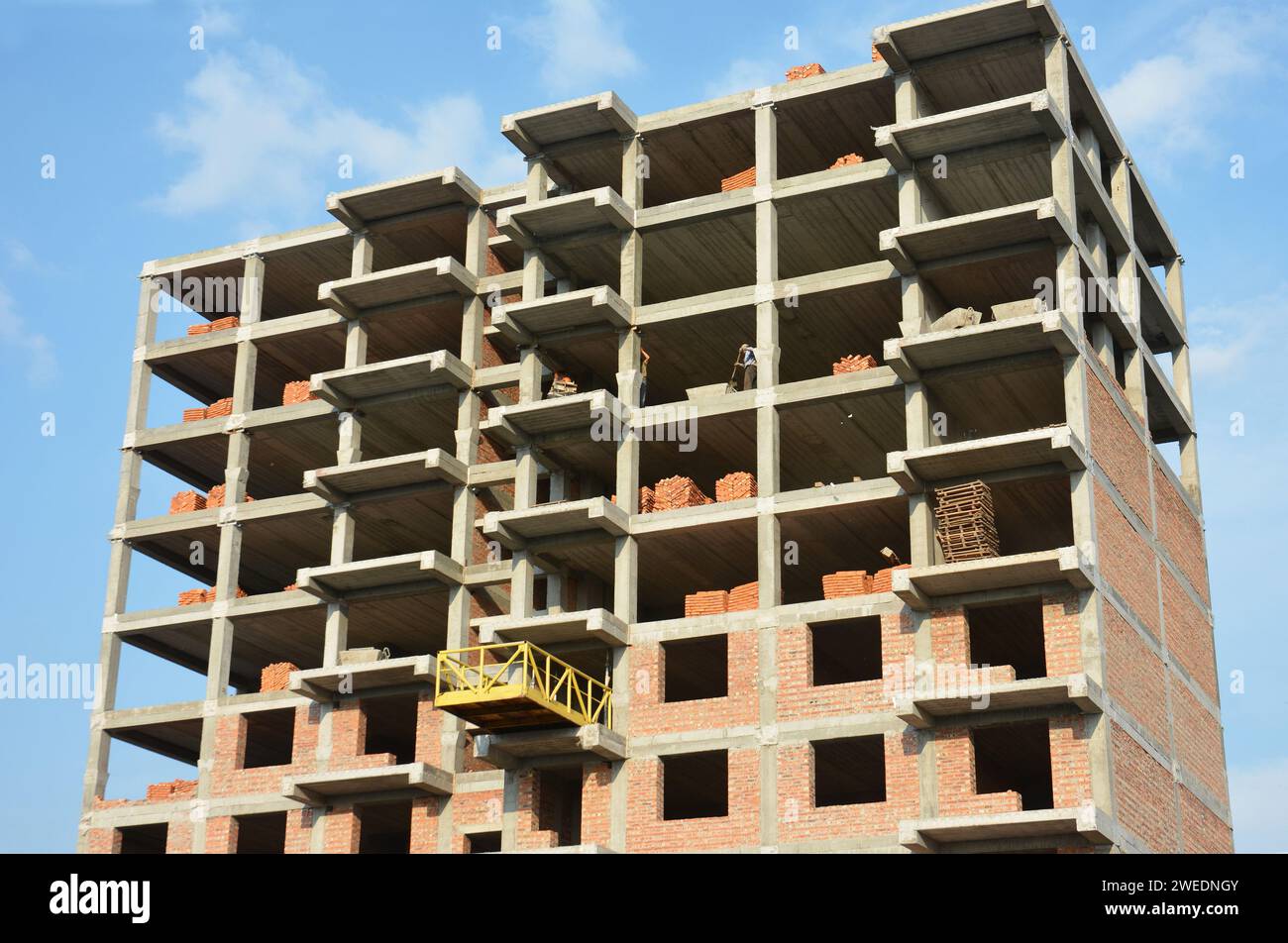 A high-rise building under construction. Building contractors on a ...