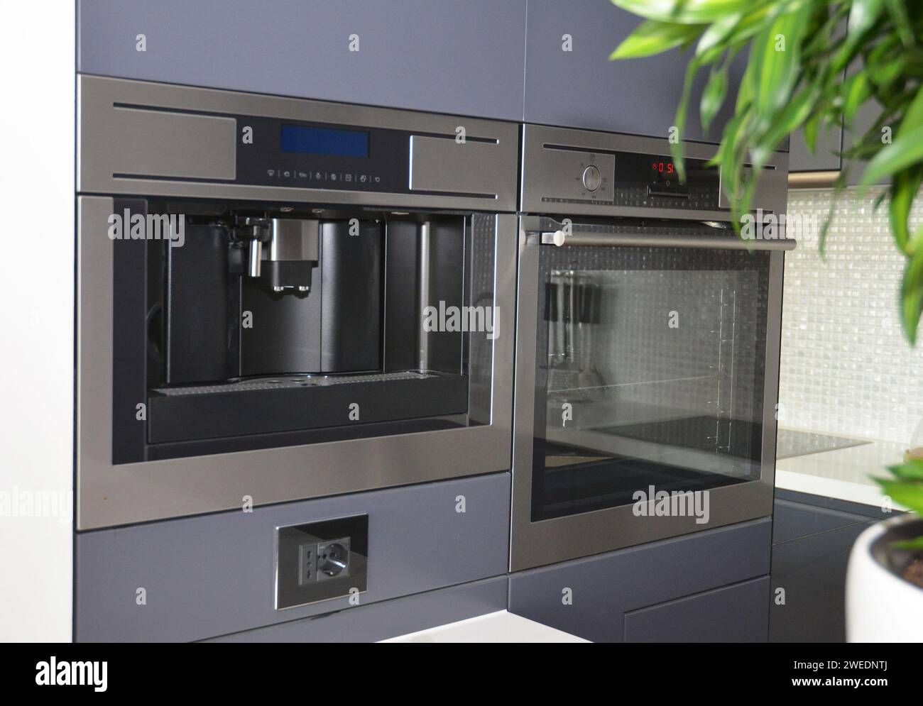 A close-up of the modern built-in kitchen appliances such as a kitchen ...