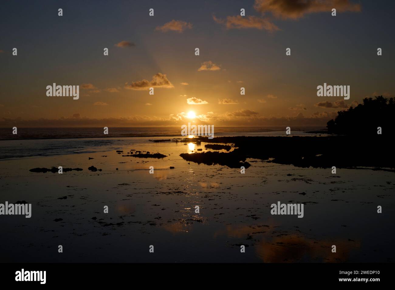 The sun rising over the coast of Siargao, Philippines Stock Photo - Alamy