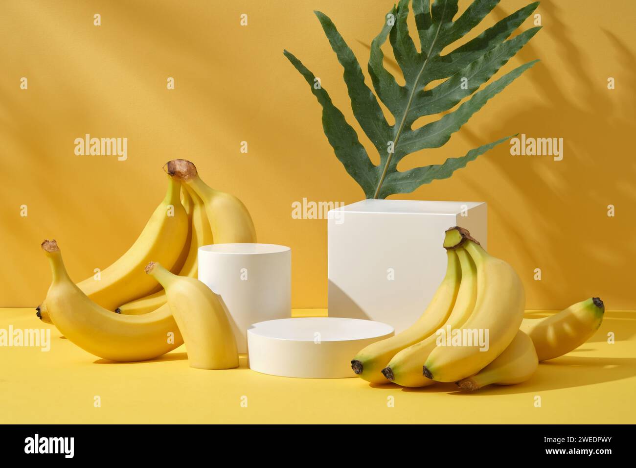Bunch of bright yellow tiny bananas decorated on a yellow background ...