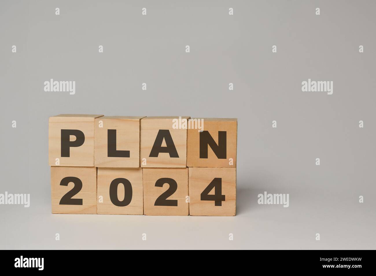 Wooden cube blocks with 2024 PLAN word on white background. Business ...