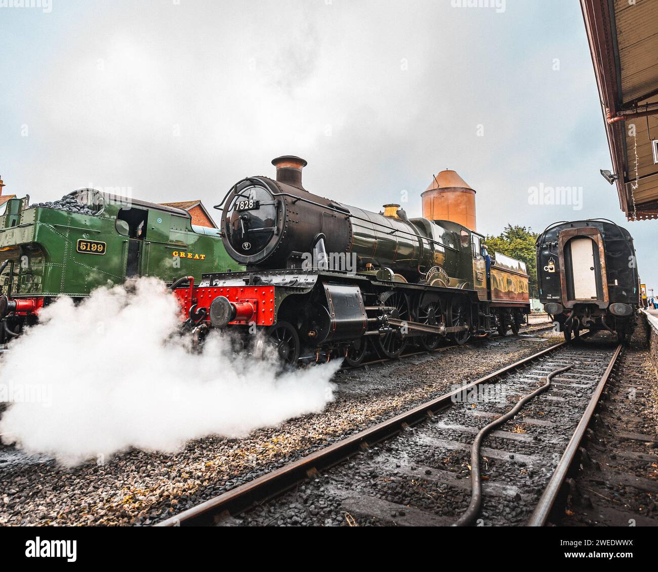Minehead Steam Railway Station with steam train Stock Photo - Alamy