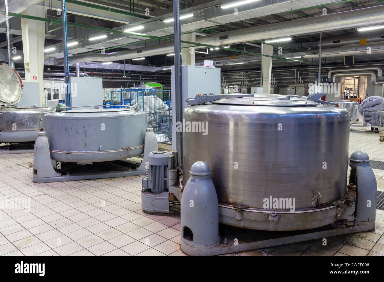 A hydraulic extractor loaded with bags of women's tights. The extractor ...