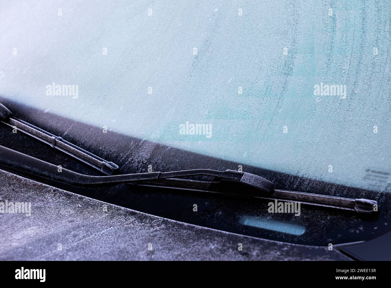 Frosty, icy, car windscreen wiper frozen to windscreen Stock Photo - Alamy