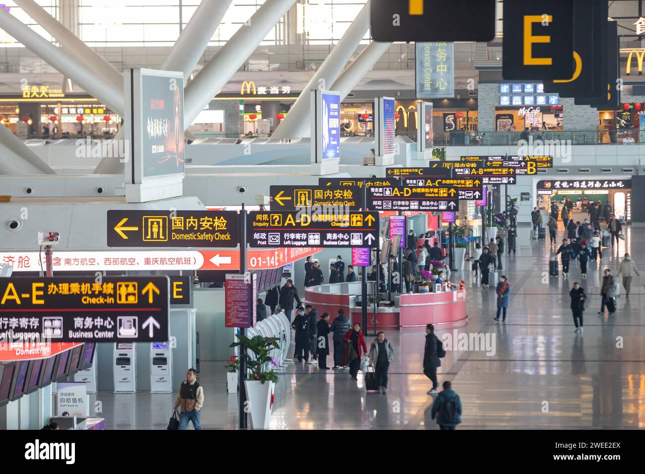 Passengers wait for planes at Zhengzhou Xinzheng International Airport ...