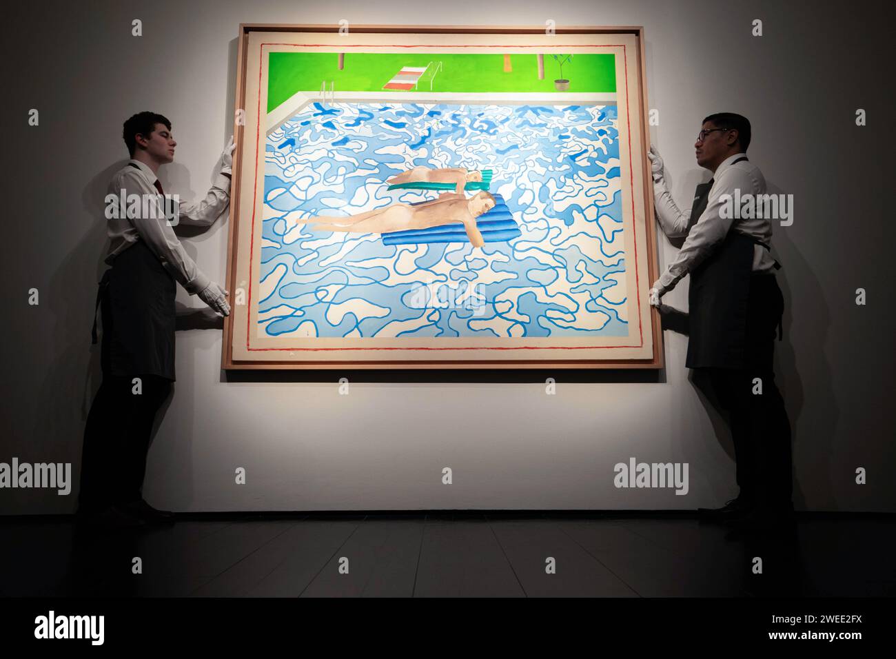 Gallery assistants hold 'California' by British artist David Hockney ...