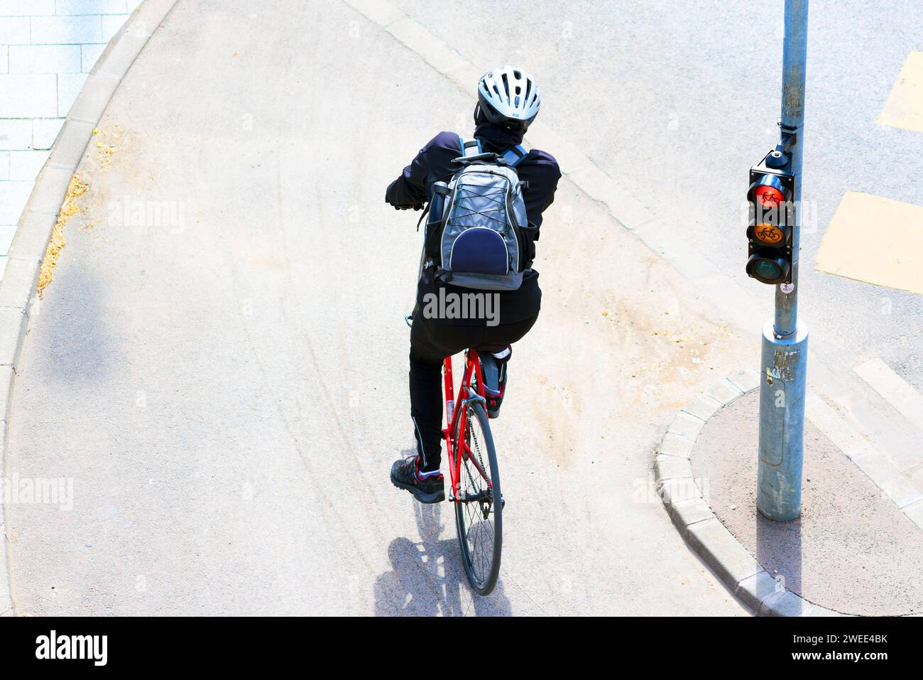 Bicyclist by traffic light, top view Stock Photo - Alamy