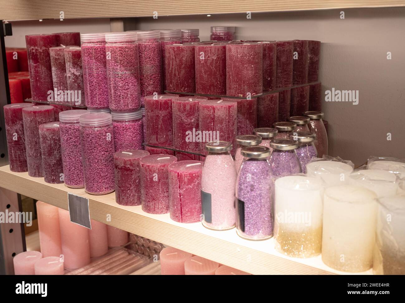 Multicolor store front or supermarket with decorative aromatic candles ...