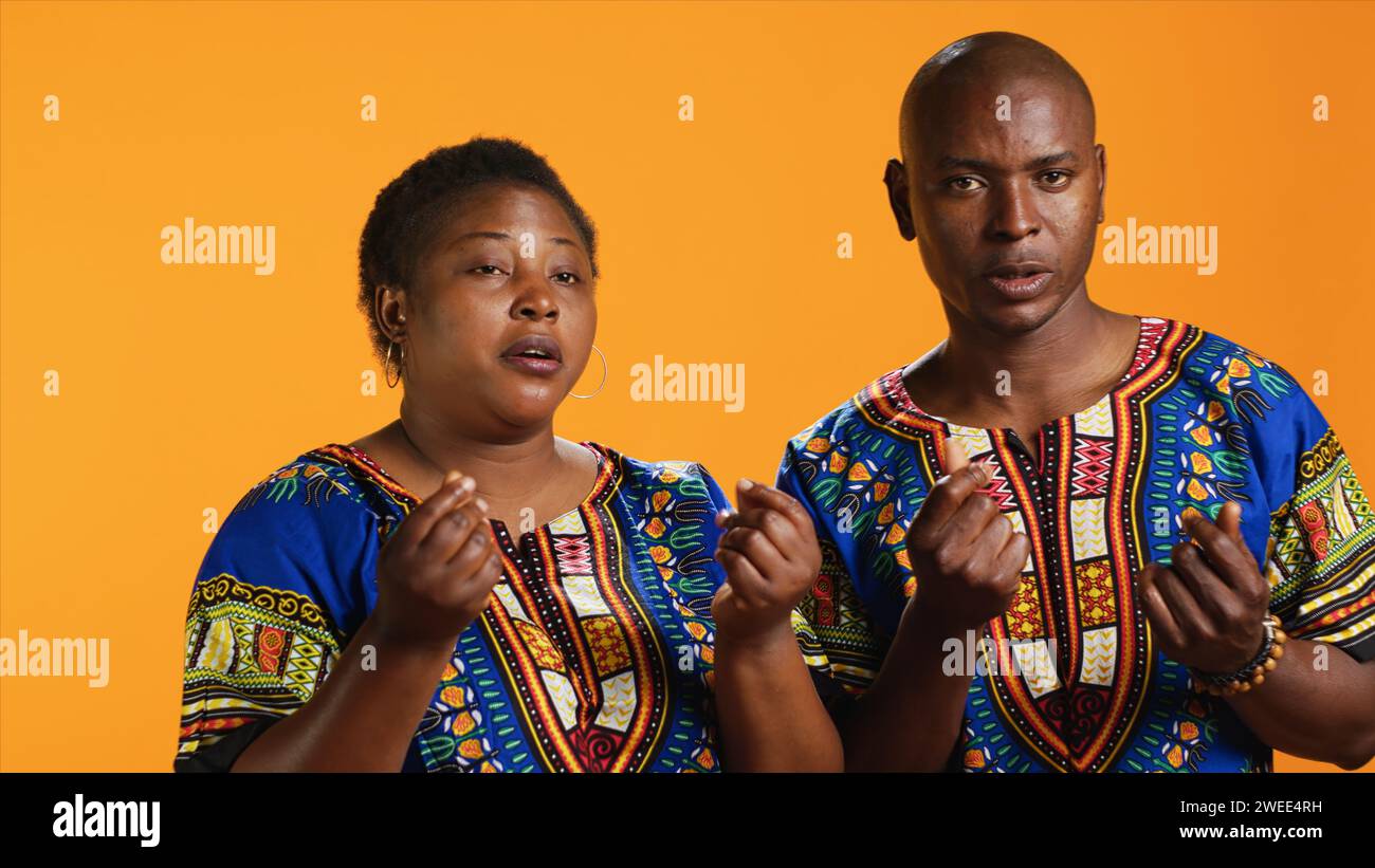 Confident african american couple asking for money with hand gesture ...