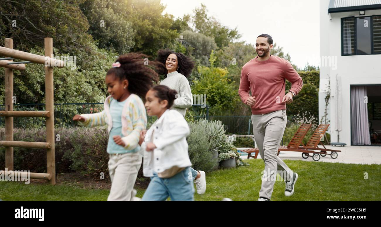 Family, running and children outdoor in backyard for playing, happiness ...