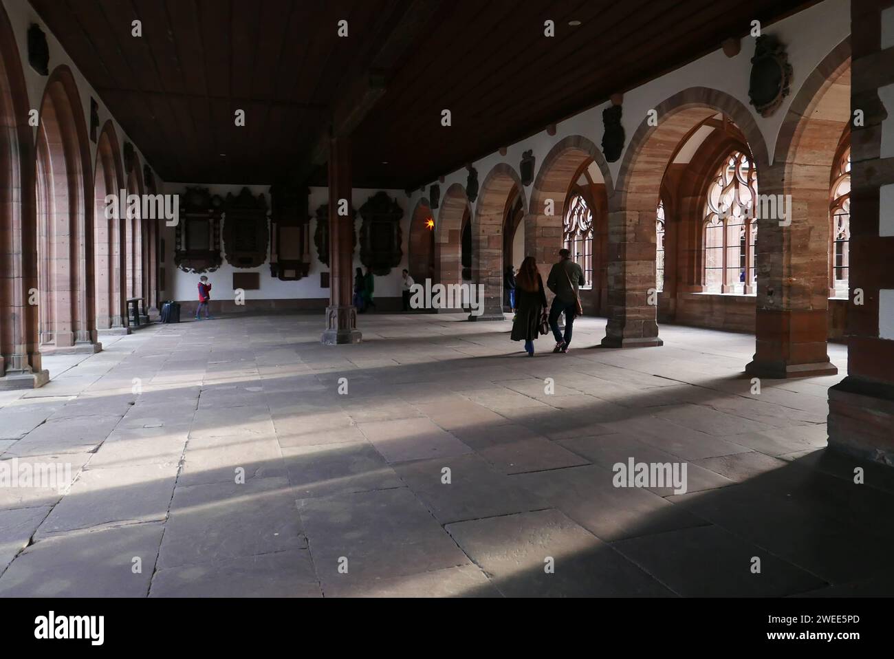 BASEL, SWITZERLAND - JANUARY 4, 2024: People in the historical Cloister ...