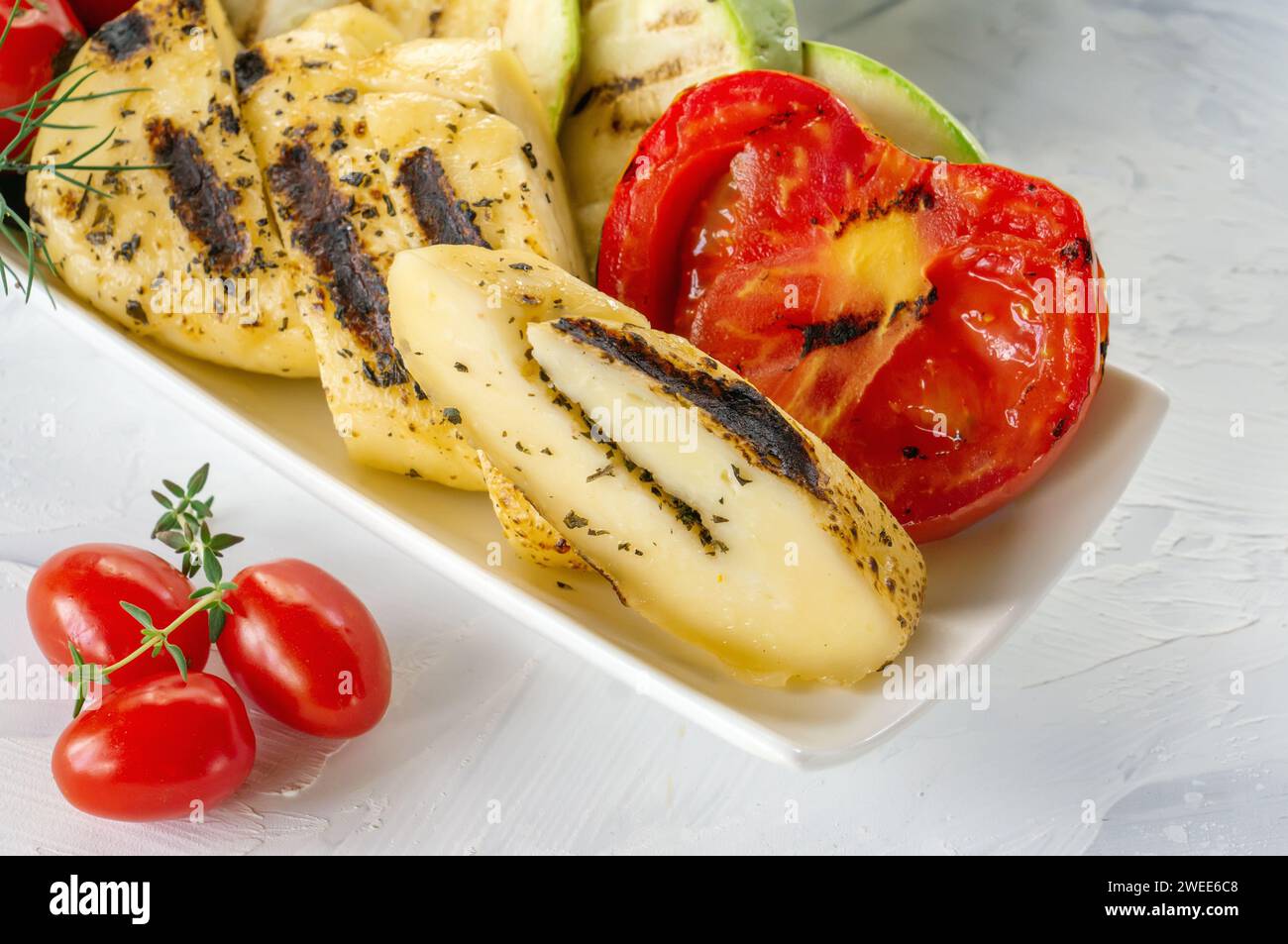 Halloumi cheese fried with aromatic herbs rosemary, thyme and grilled ...