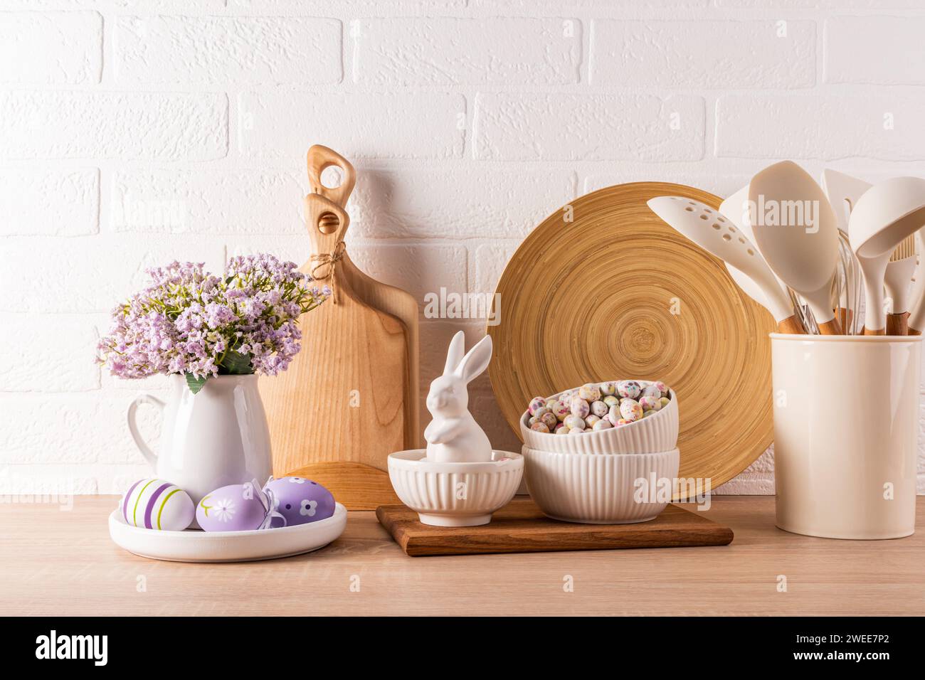 Easter holiday decorations on a wooden kitchen countertop with eco ...