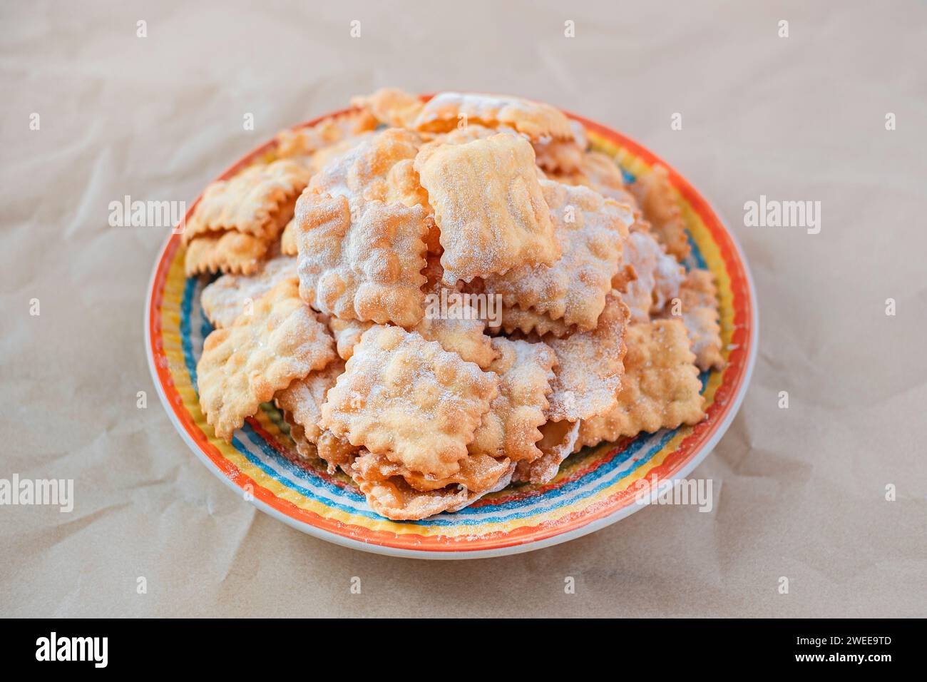 Traditional sweet crisp pastry deep-fried and sprinkled with powdered ...