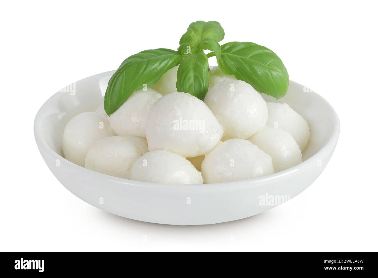 Mini mozzarella balls with basil in a ceramic bowl isolated on white ...