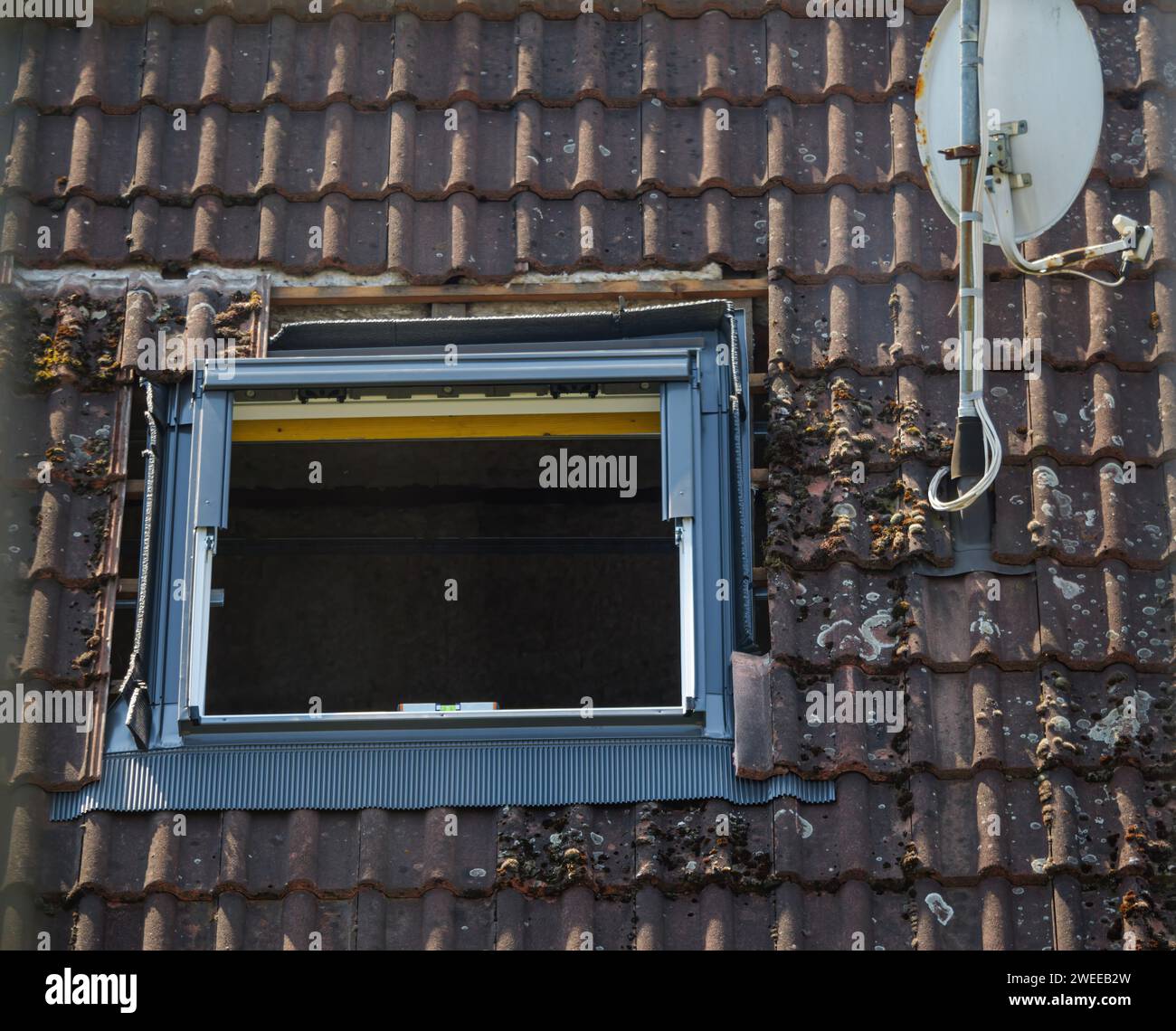 Installing a new window near a satellite reception antenna dish Stock ...