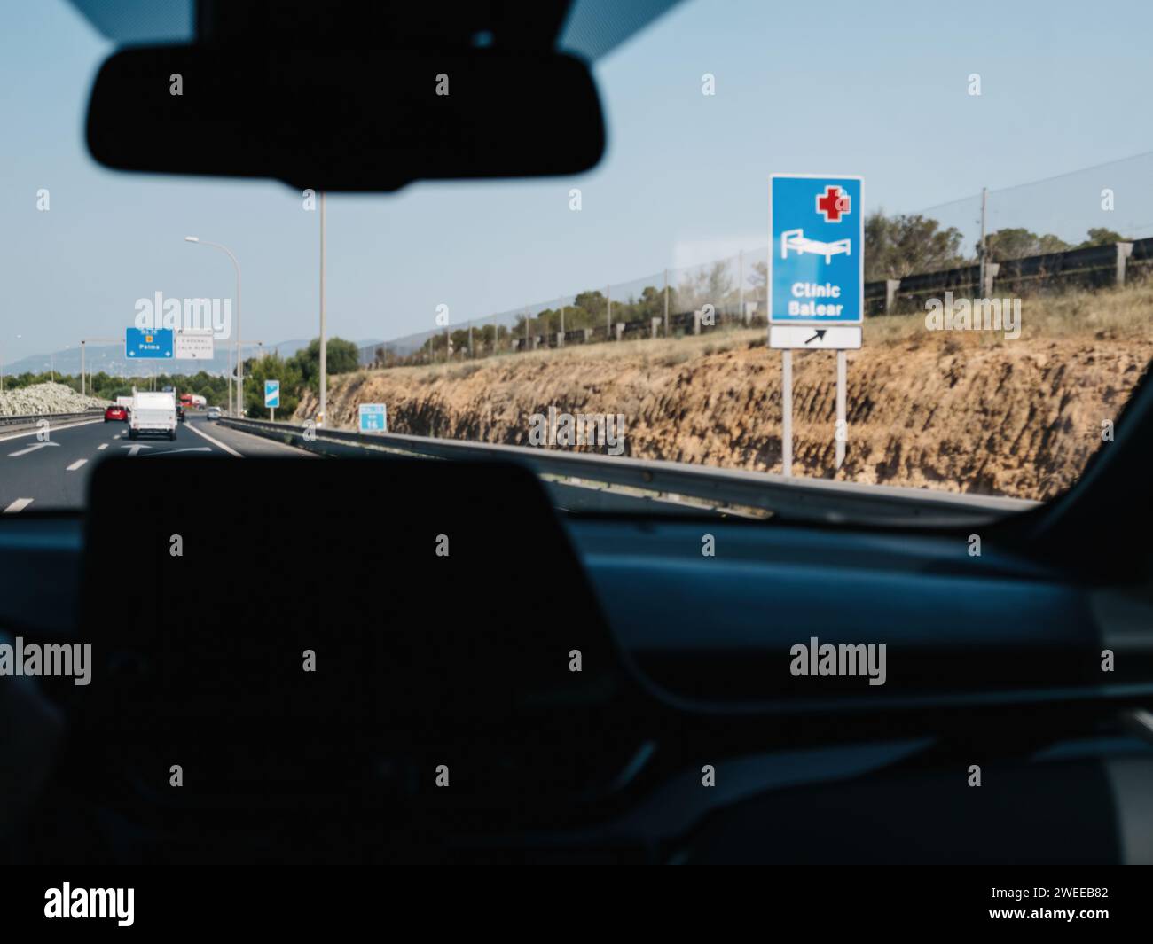 A defocused view from inside a driving car at the Clinica Balera ...