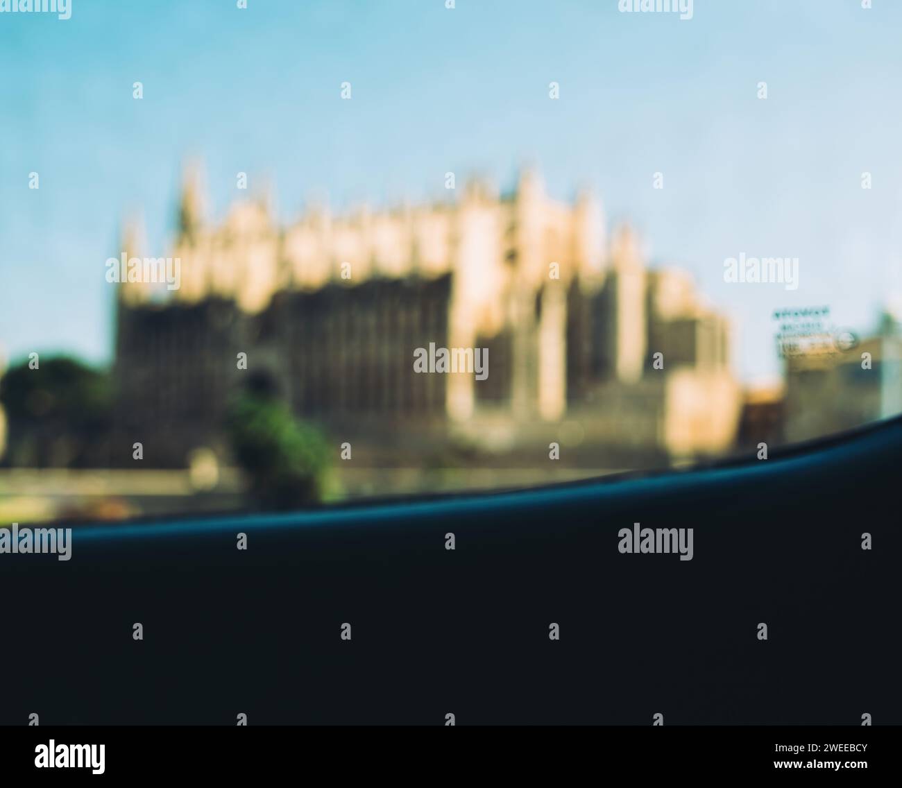 A hazy photograph captured from inside a driving car, using a tilt ...