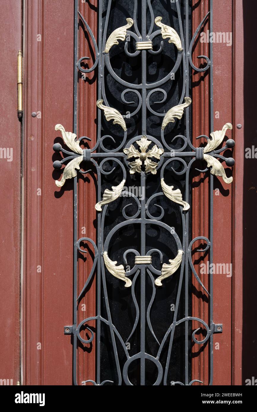 decorative wrought iron grille on the door. Detail of beautifully ...