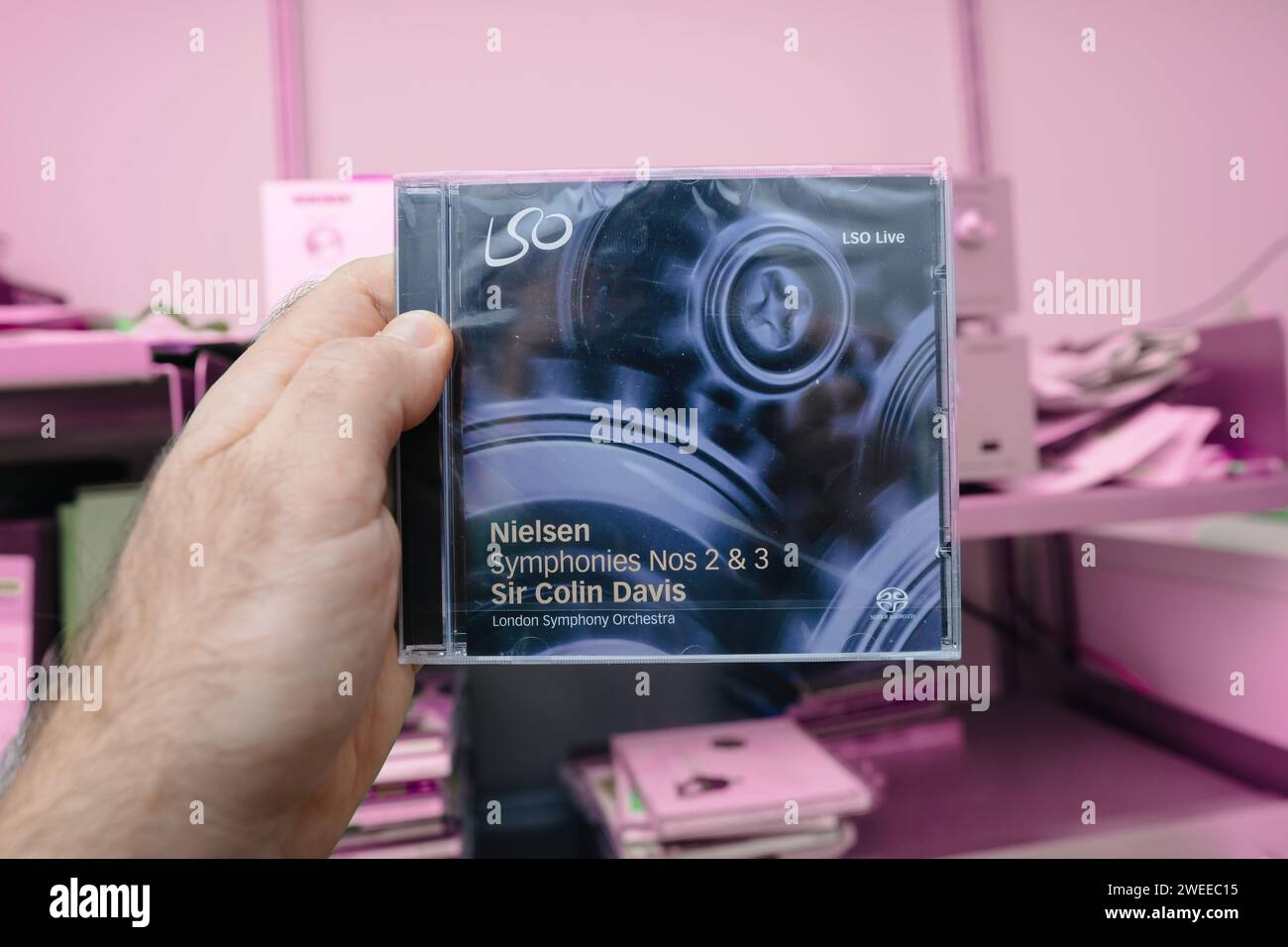 Paris, France - Dec 28, 2023: male hand, in an audiophile's ...