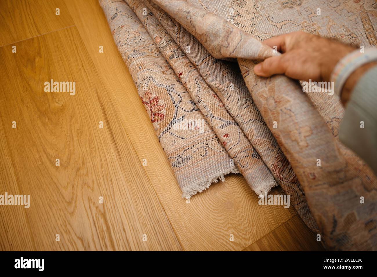 A male is measuring the thickness and inspecting the texture of the new ...