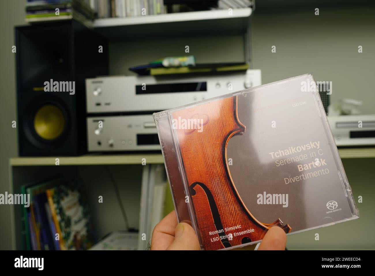 Paris, France - Jan 21, 2024: A male hand delicately holds an ACD disk ...