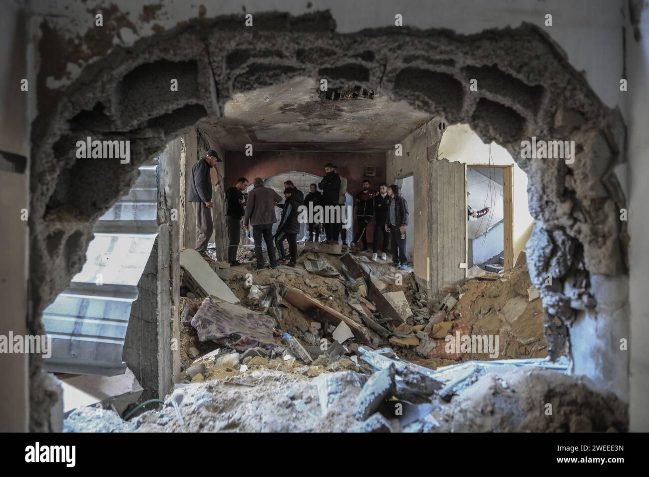 Rafah, Palestinian Territories. 25th Jan, 2024. Palestinians inspect a ...