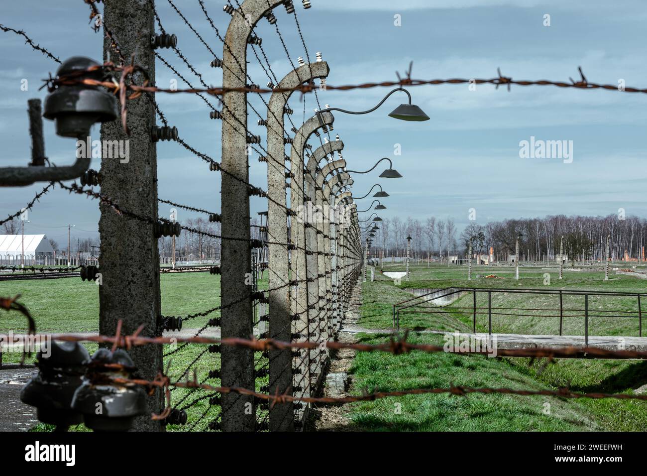 Barbed wire fence on Auschwitz concentration camp in Poland Stock Photo ...