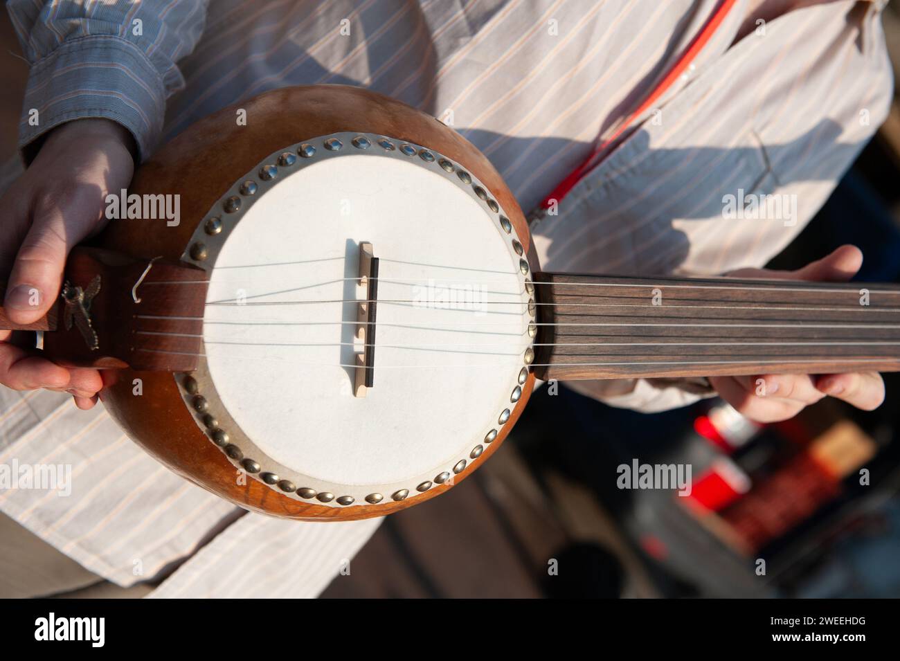 A homemade gourd banjo, A hybrid of the African Akontig and the ...