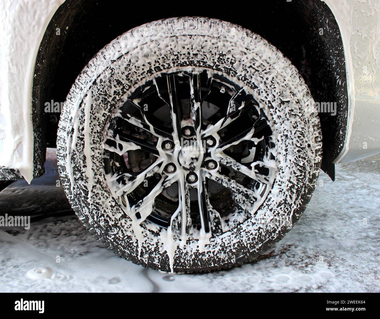 Detailed Photo Of Car Wheel Covered With Foam At Car Washing Stock ...