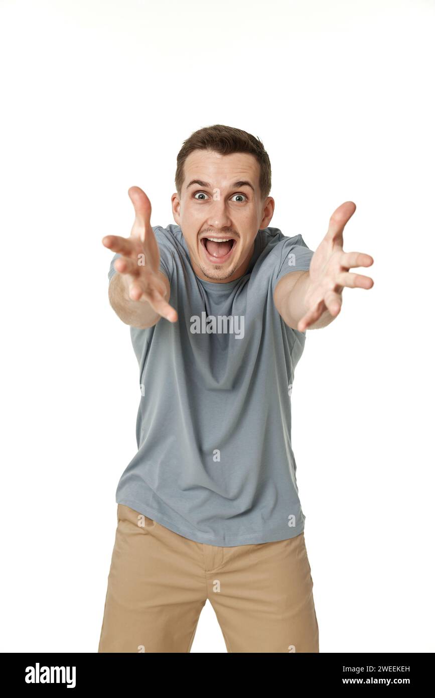 happy guy pointing at the camera on white studio background Stock Photo ...