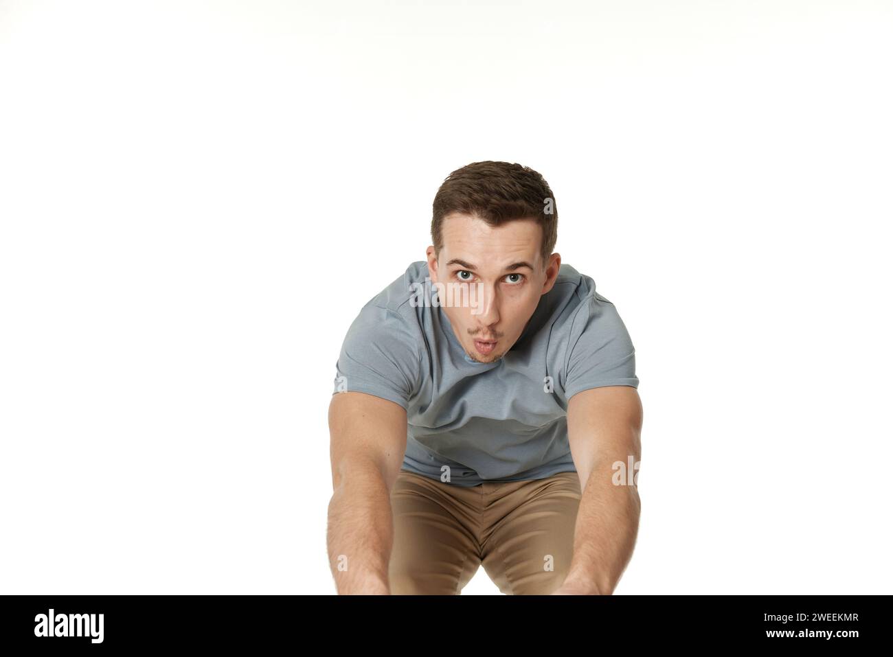 happy guy looking pointing at the camera on white studio background ...