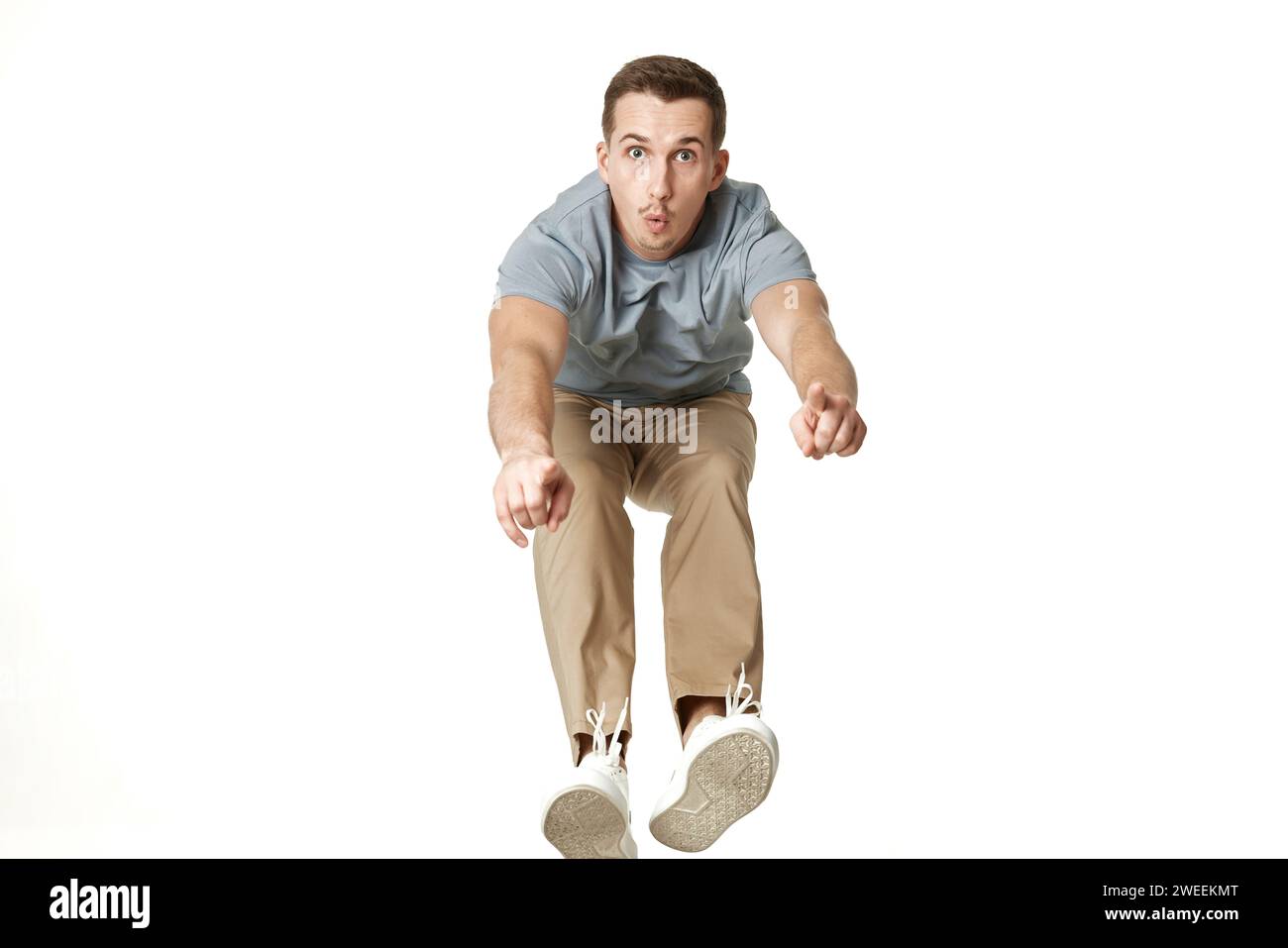 happy guy looking pointing at the camera on white studio background ...