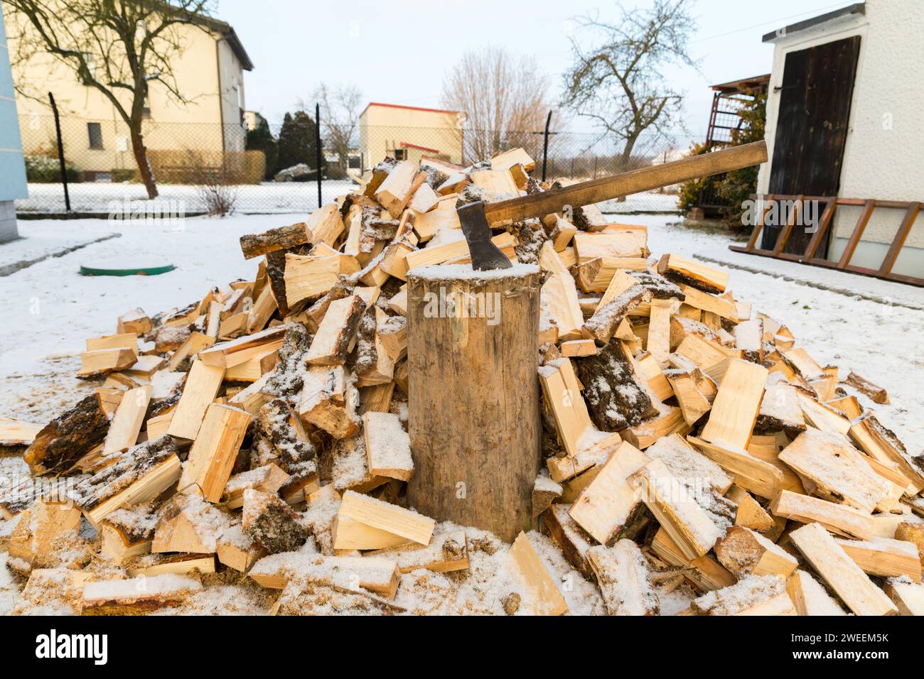 An ax for splitting firewood stuck into a stump for chopping wood Stock ...