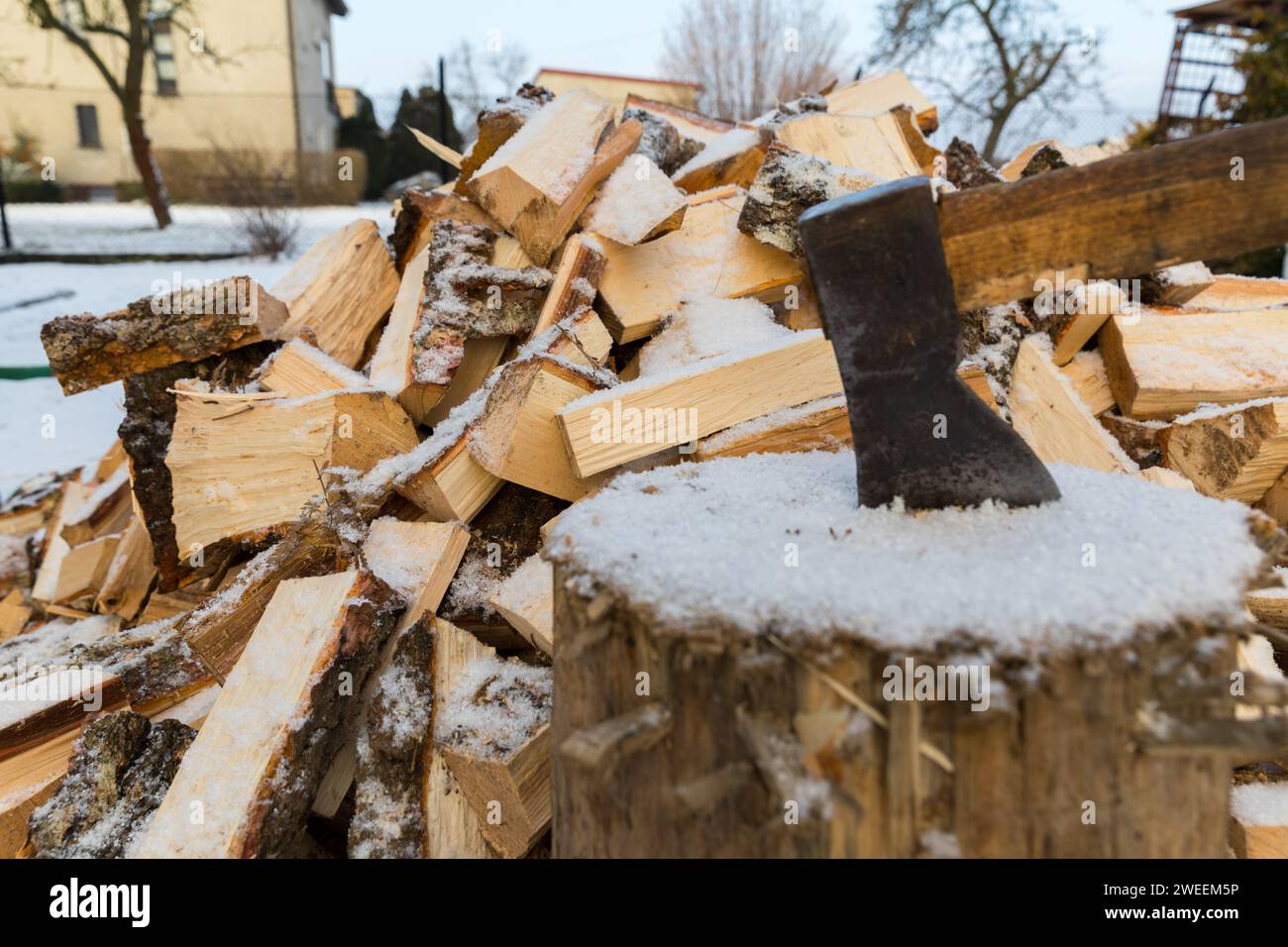 An ax for splitting firewood stuck into a stump for chopping wood Stock ...