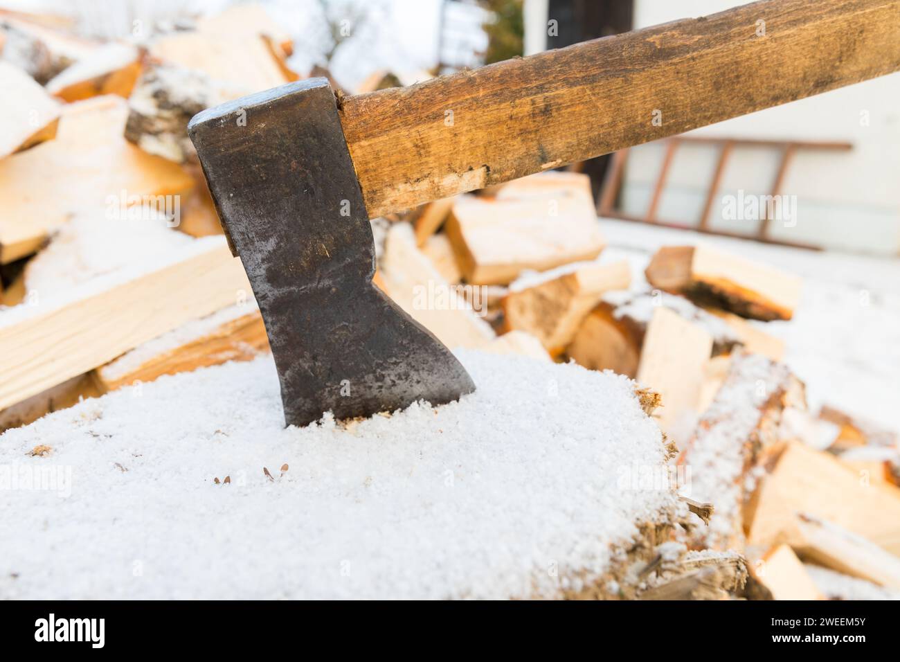 An ax for splitting firewood stuck into a stump for chopping wood Stock ...