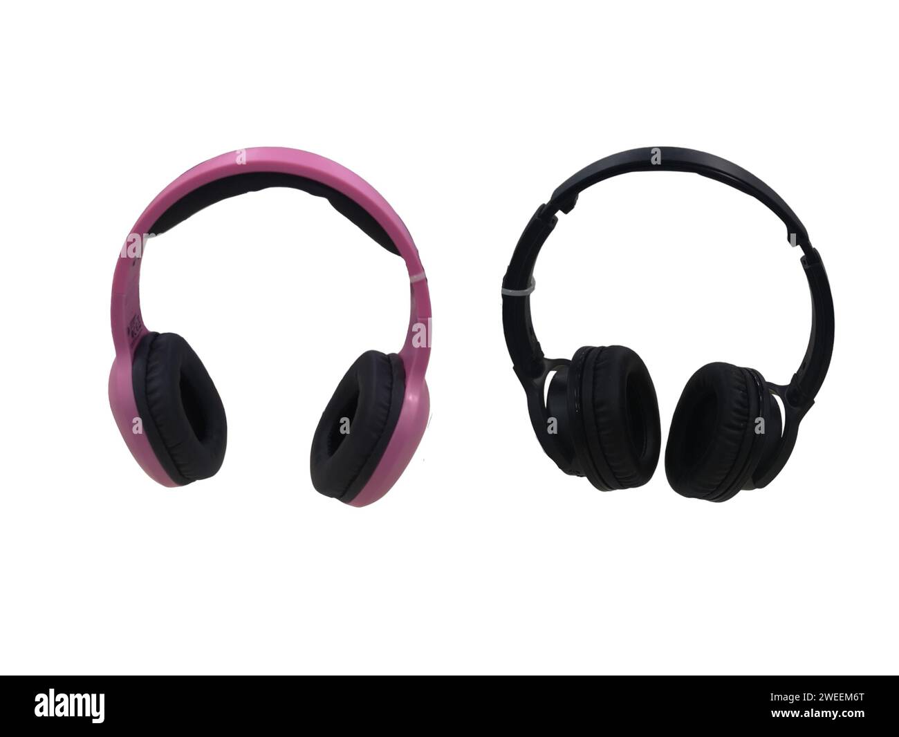 Two pairs of pink headphone headsets, resting side by side on a white ...