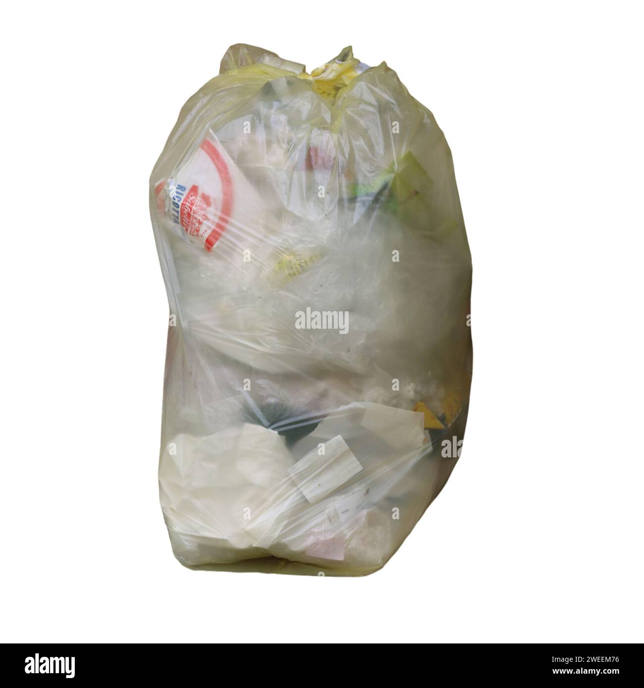 A garbage bag filled with plastic waste, including two plastic forks ...