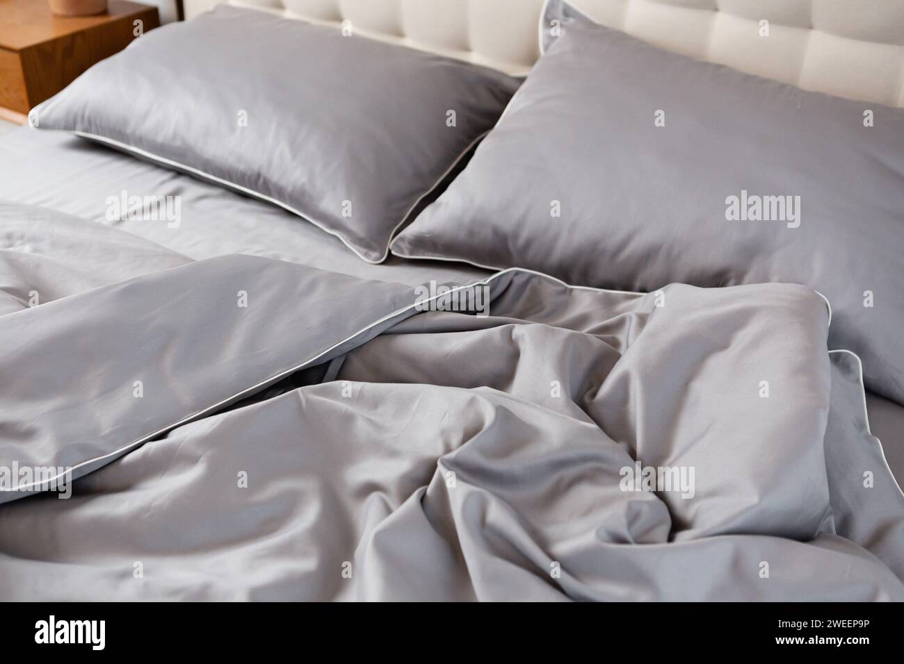 Texture of gray satin bed linen with waves fabric morning messy Stock ...