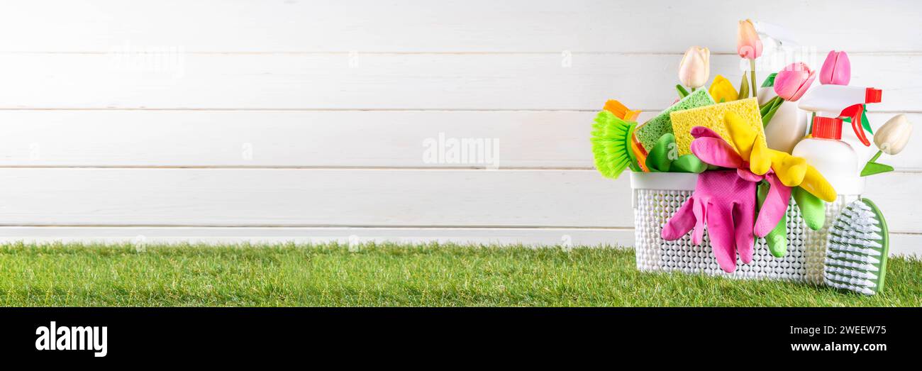 Spring cleaning background. Set of cleaning supplies, bottles ...