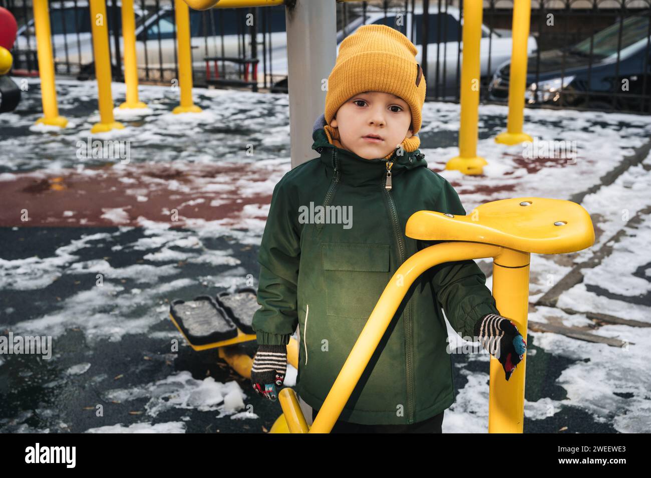 Sad lonely child kid boy playing on the playground alone in park in ...