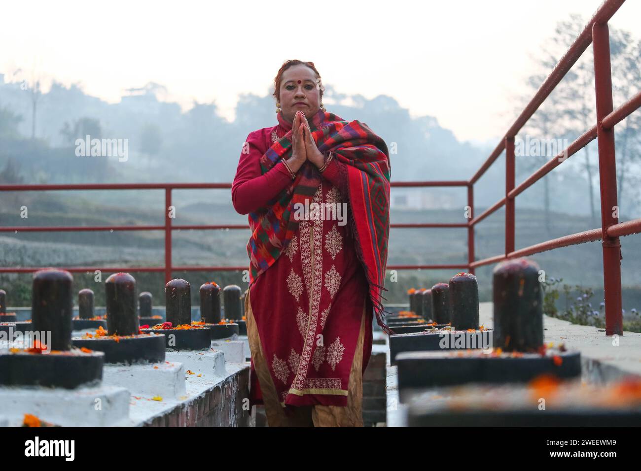 Kathmandu, Nepal. 25th Jan, 2024. A devotee offers a ritual prayer ...