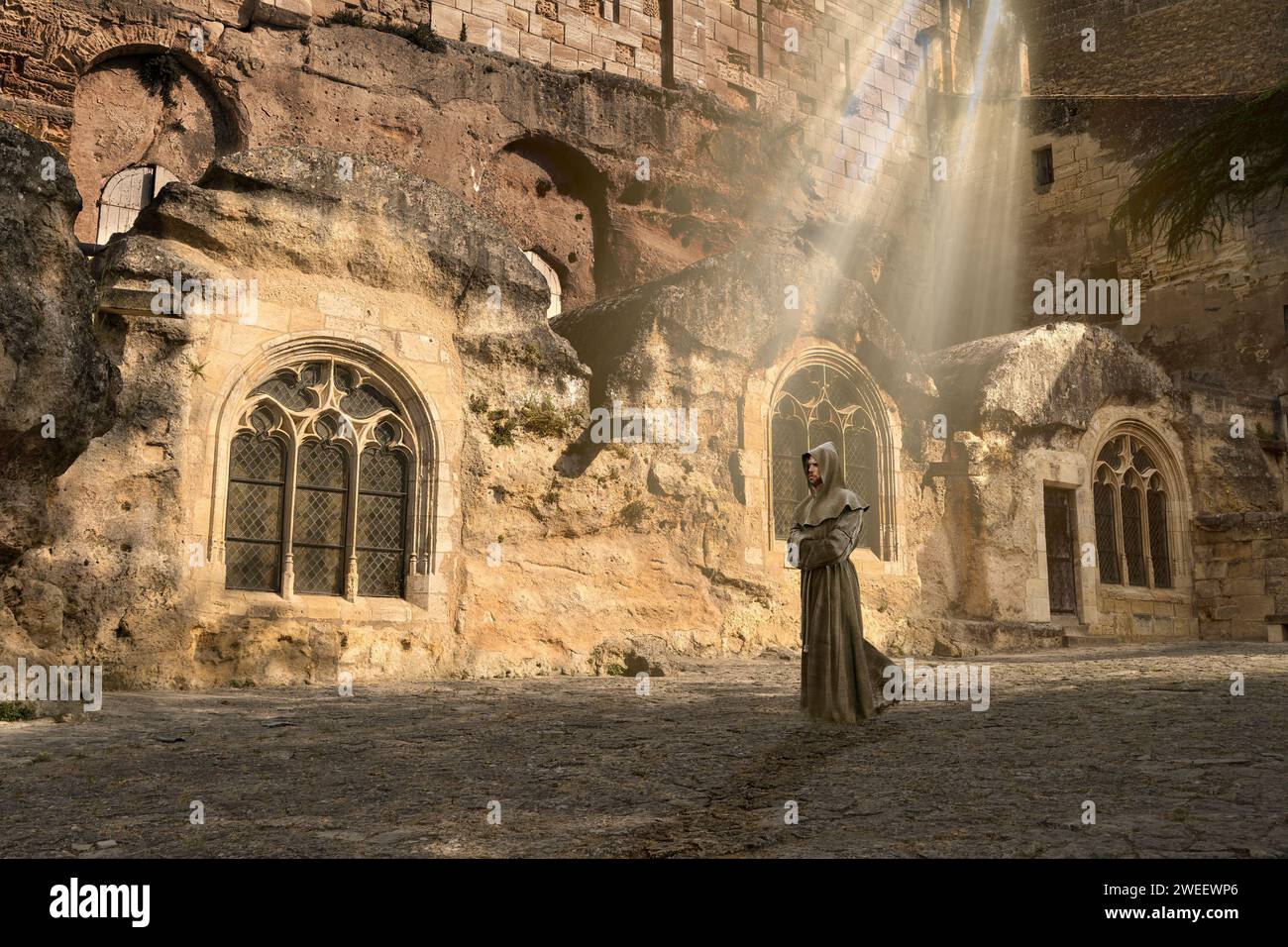 Monk and Gothic Monolithic church Saint Emilion France Stock Photo - Alamy