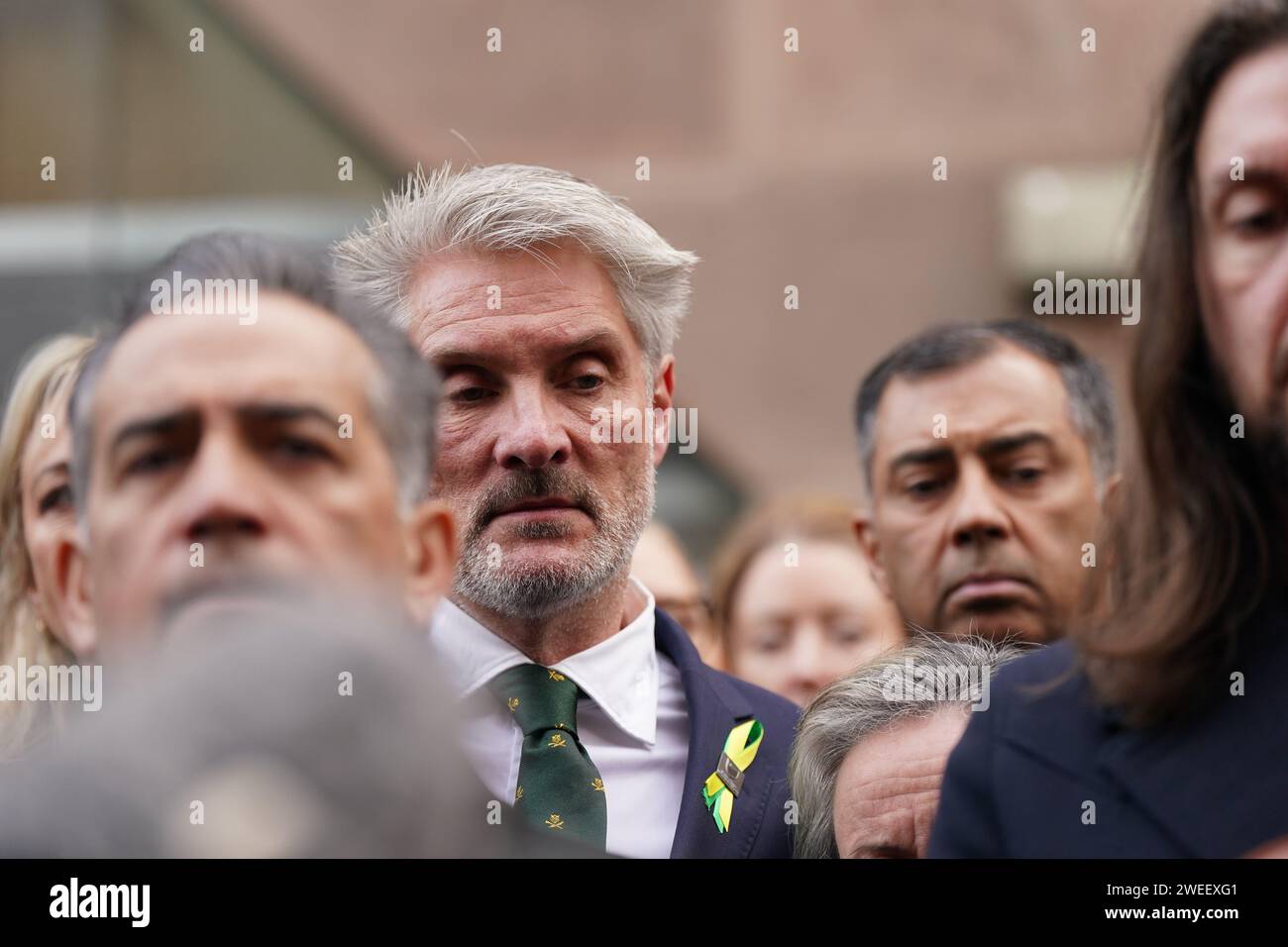 David Webber, father of Barnaby Webber listens to statements being read ...