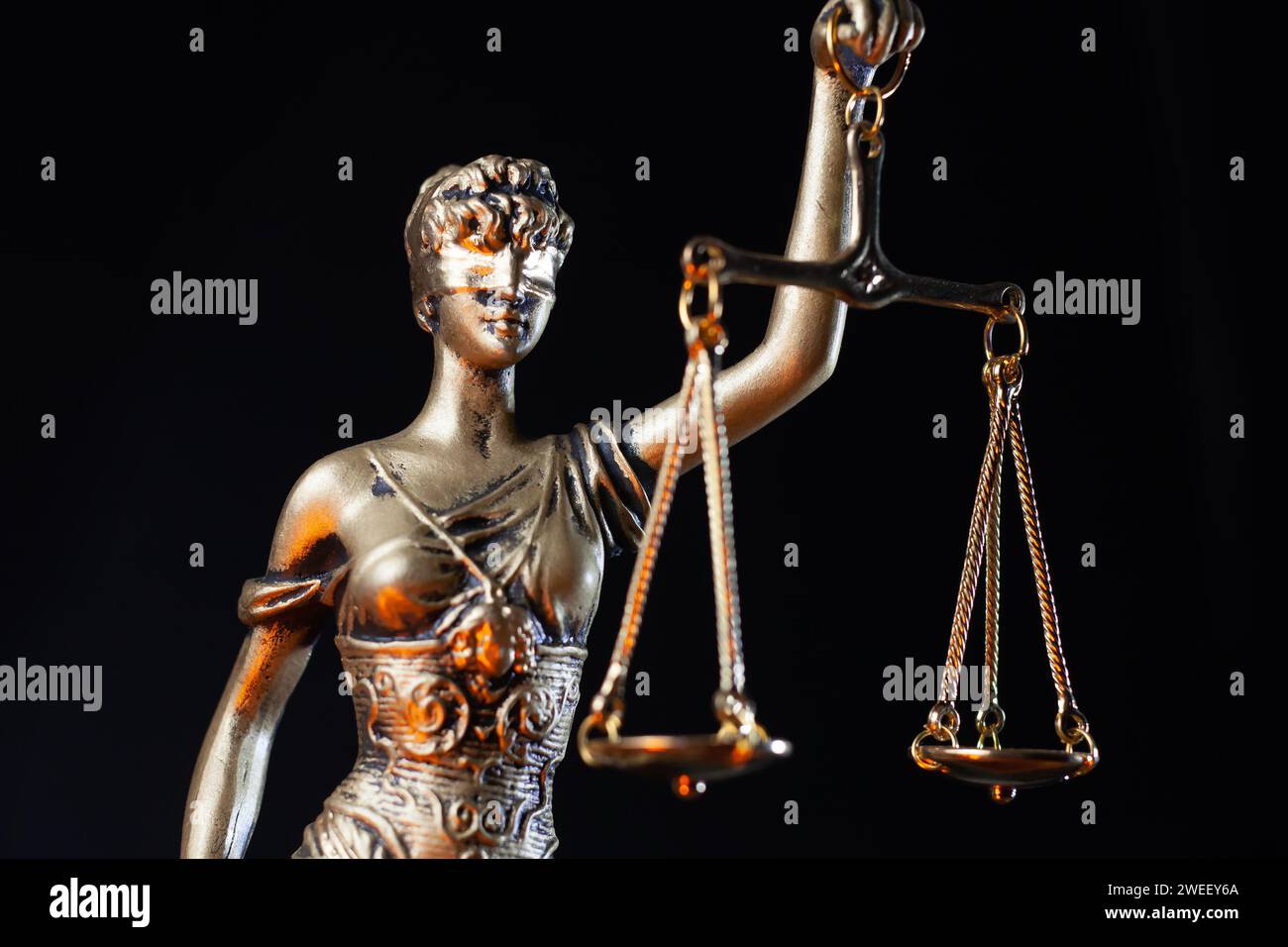detail of lady justice statue isolated on dark background Stock Photo - Alamy