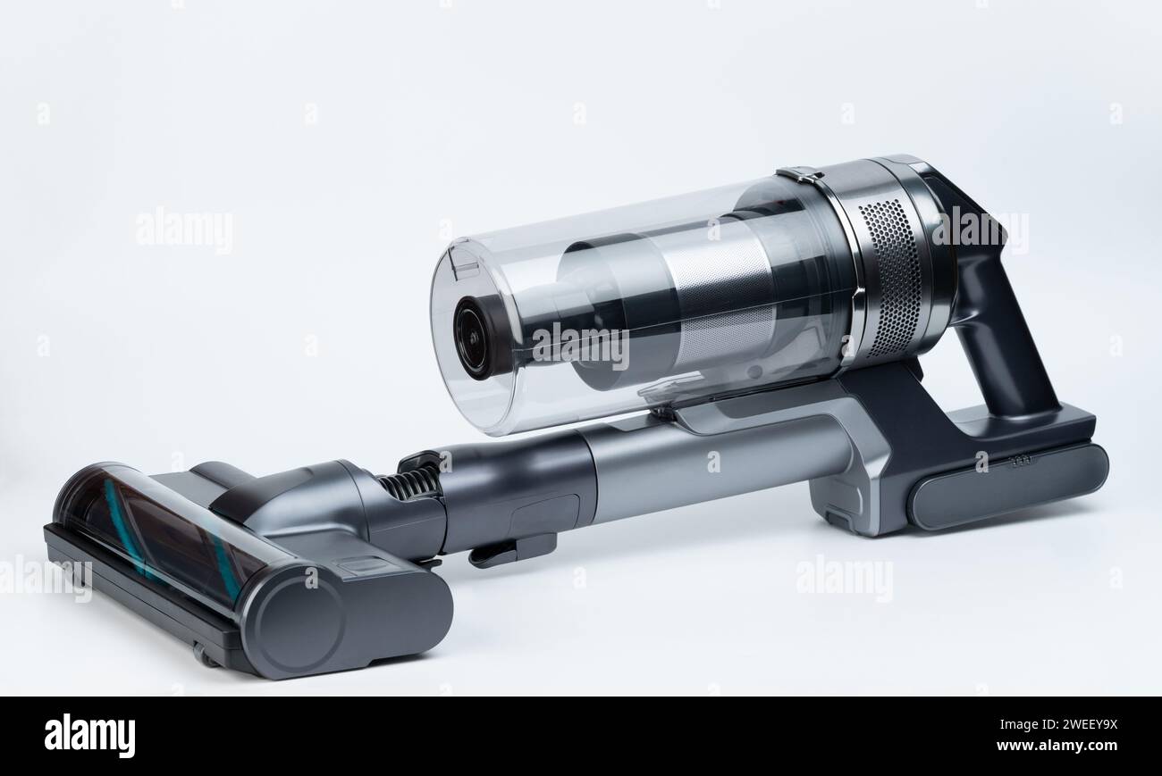 Mini grey vacuum cleaner with brush on white studio background Stock ...