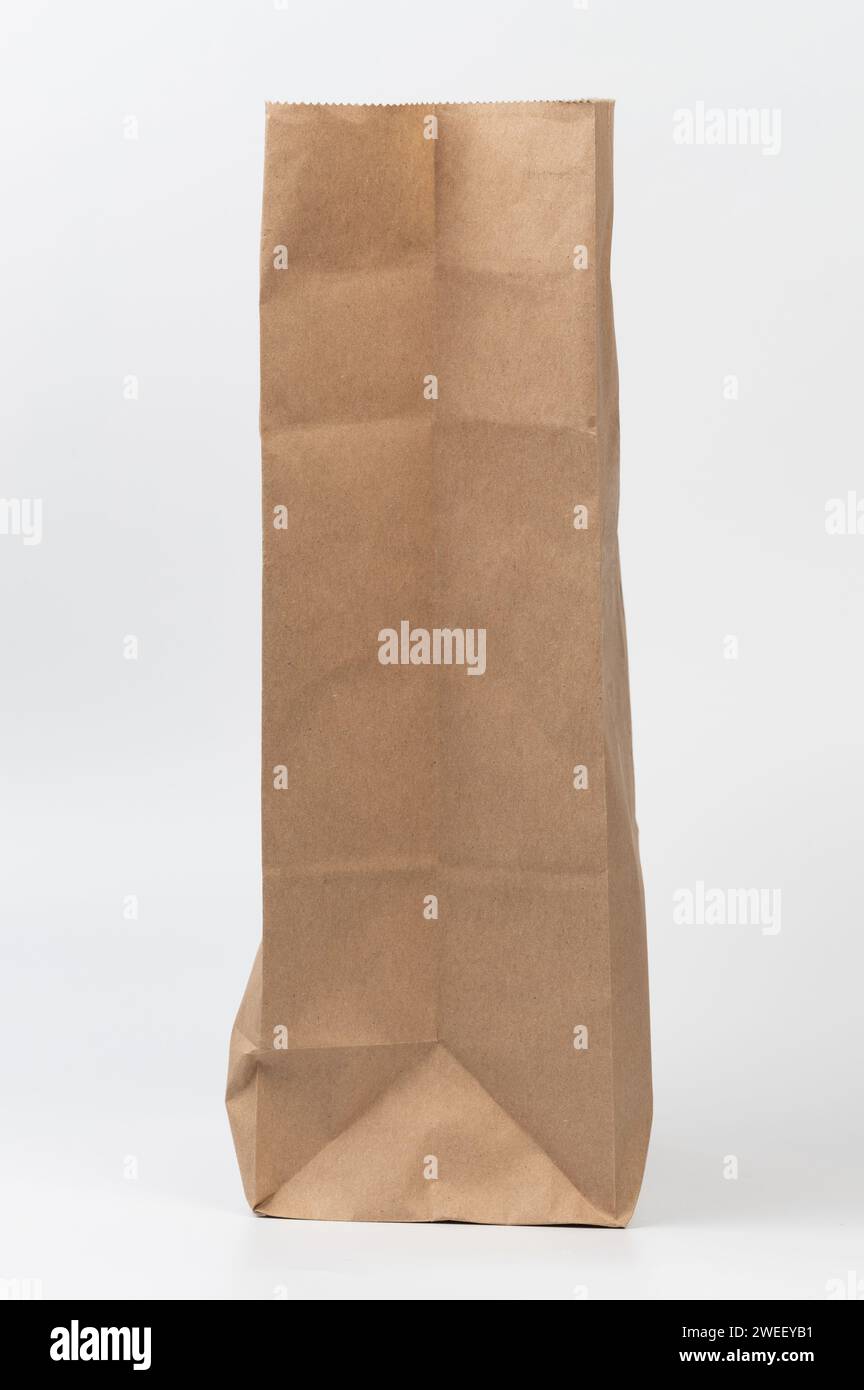 Close up of brown paper bag side view isolated on studio background ...