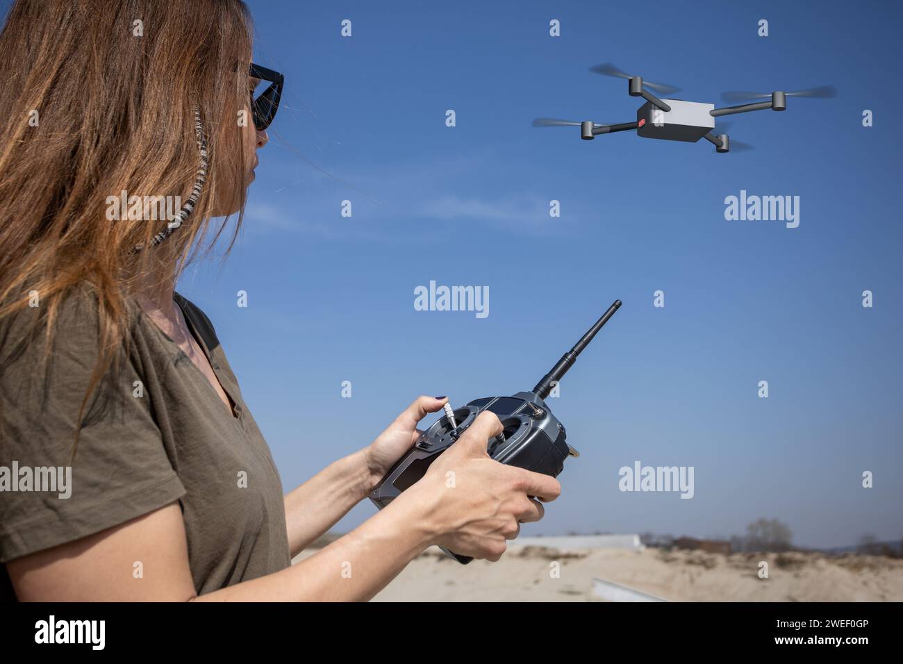 Young woman holding controller drone hi-res stock photography and ...