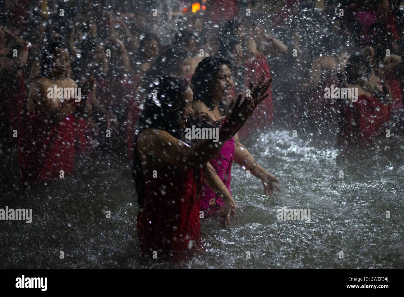 On January 25, 2024, in Kathmandu, Nepal. Women devotees sprinkle holy ...