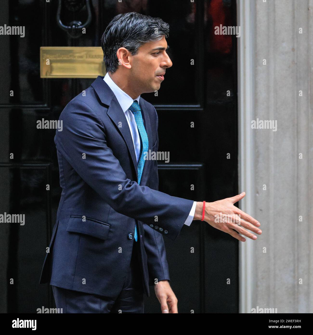 Rishi Sunak, MP, Prime Minister of the United Kingdom, alone, hand stretched out to welcome a ...